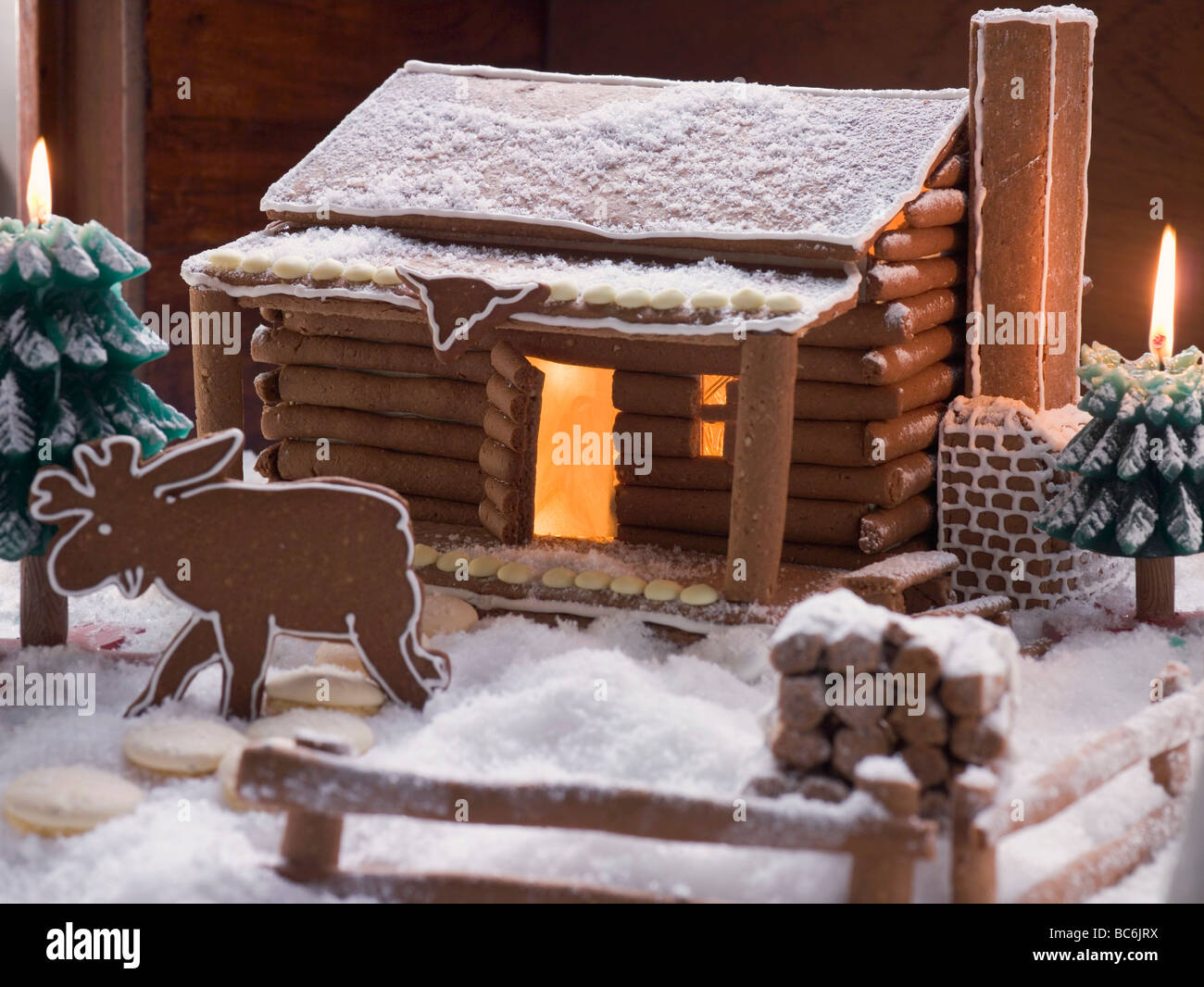 Gingerbread log cabin in snowy forest with gingerbread elk Stock Photo ...