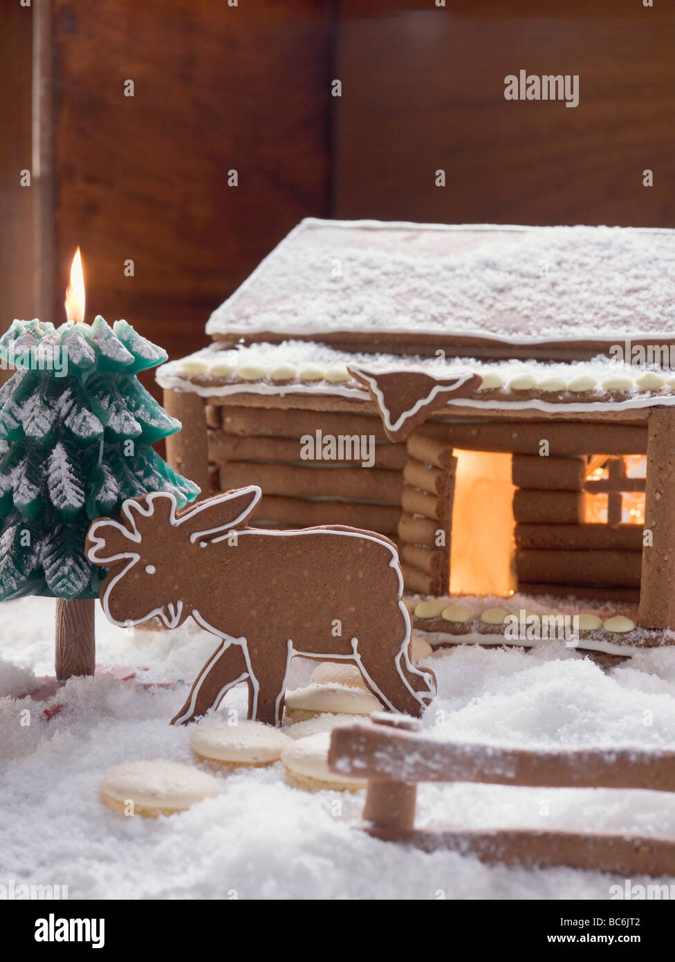 Gingerbread log cabin in snowy forest with gingerbread elk Stock Photo ...