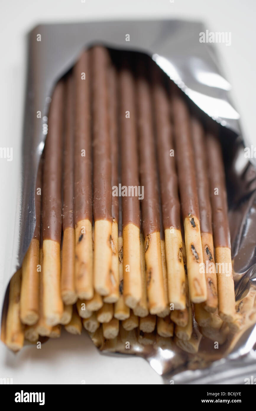 Chocolate sticks in opened packaging Stock Photo - Alamy