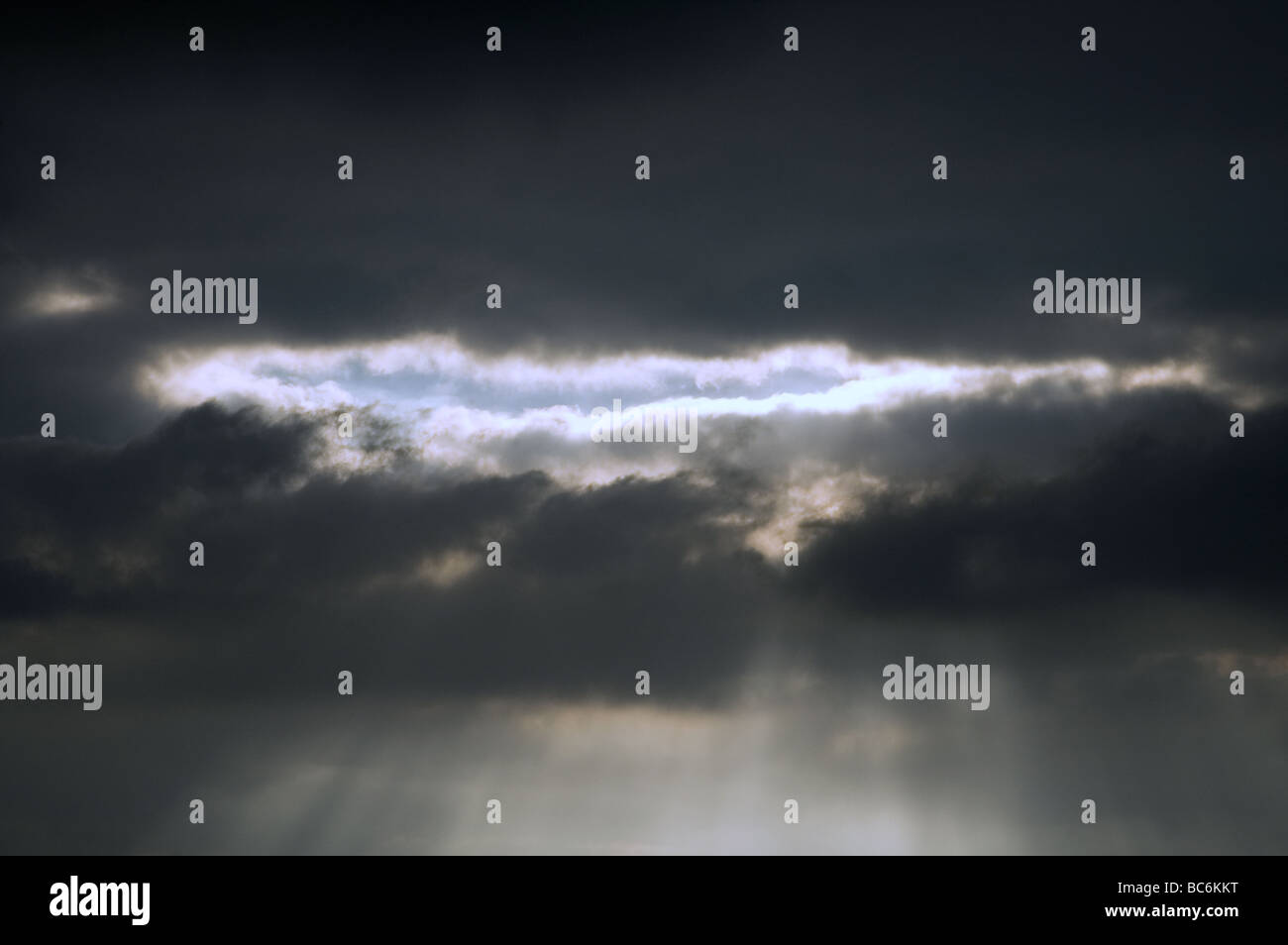 A break in the dark rain clouds Stock Photo - Alamy
