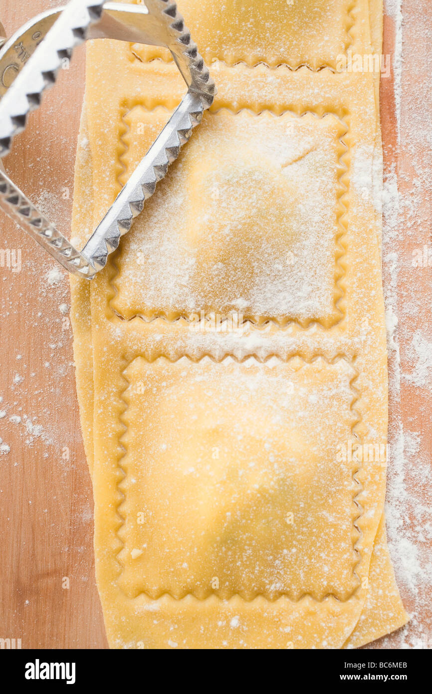Cutting out home-made ravioli Stock Photo - Alamy