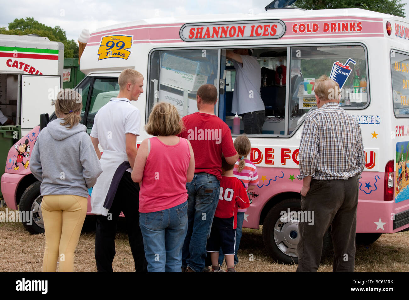 People queuing for ice cream at ice cream van Stock Photo - Alamy