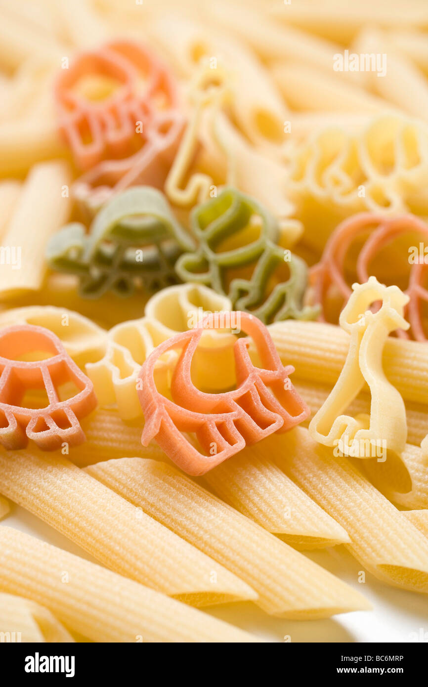 Coloured animal-shaped pasta and penne Stock Photo - Alamy