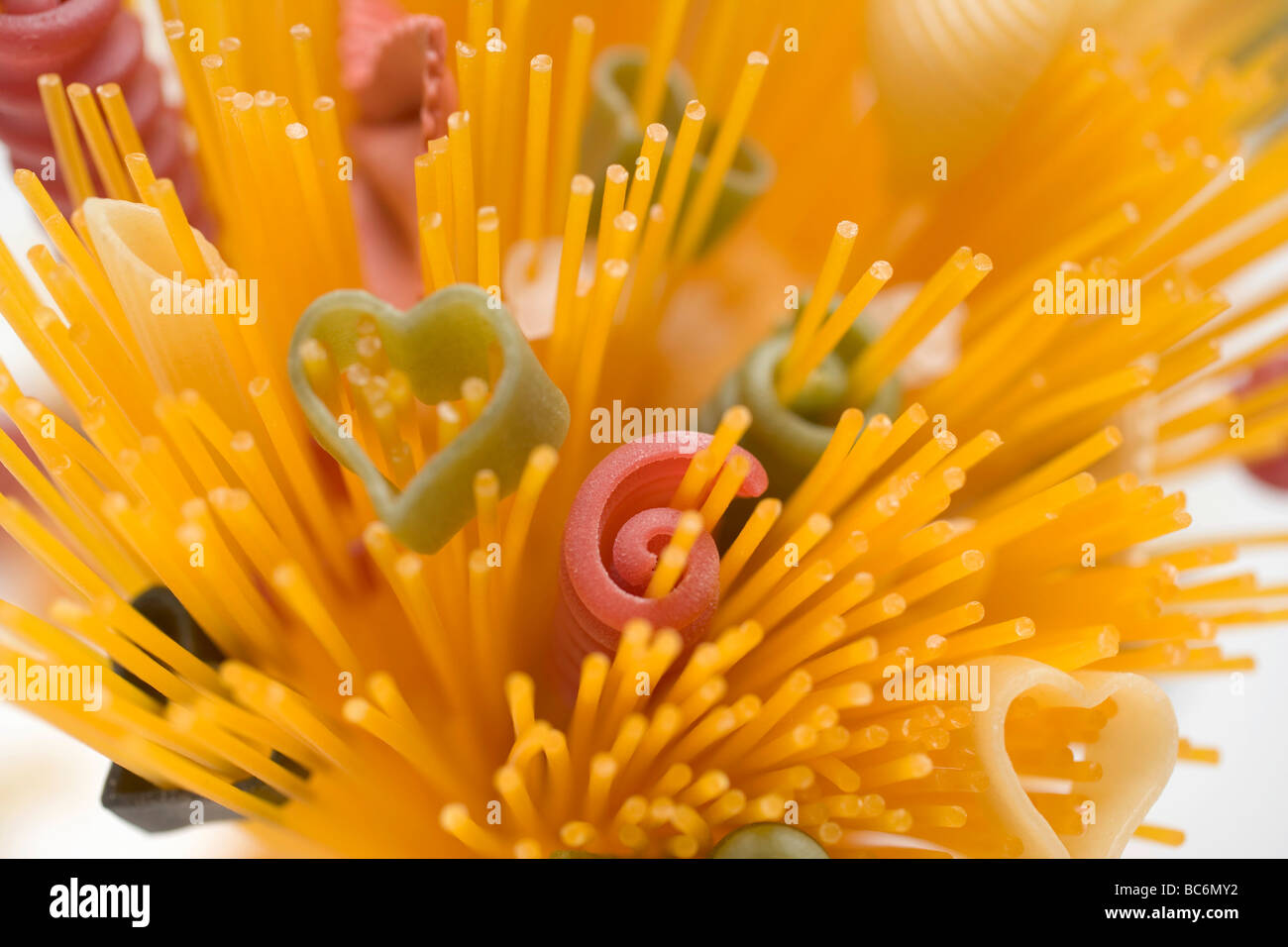 Spaghetti and coloured pasta Stock Photo - Alamy