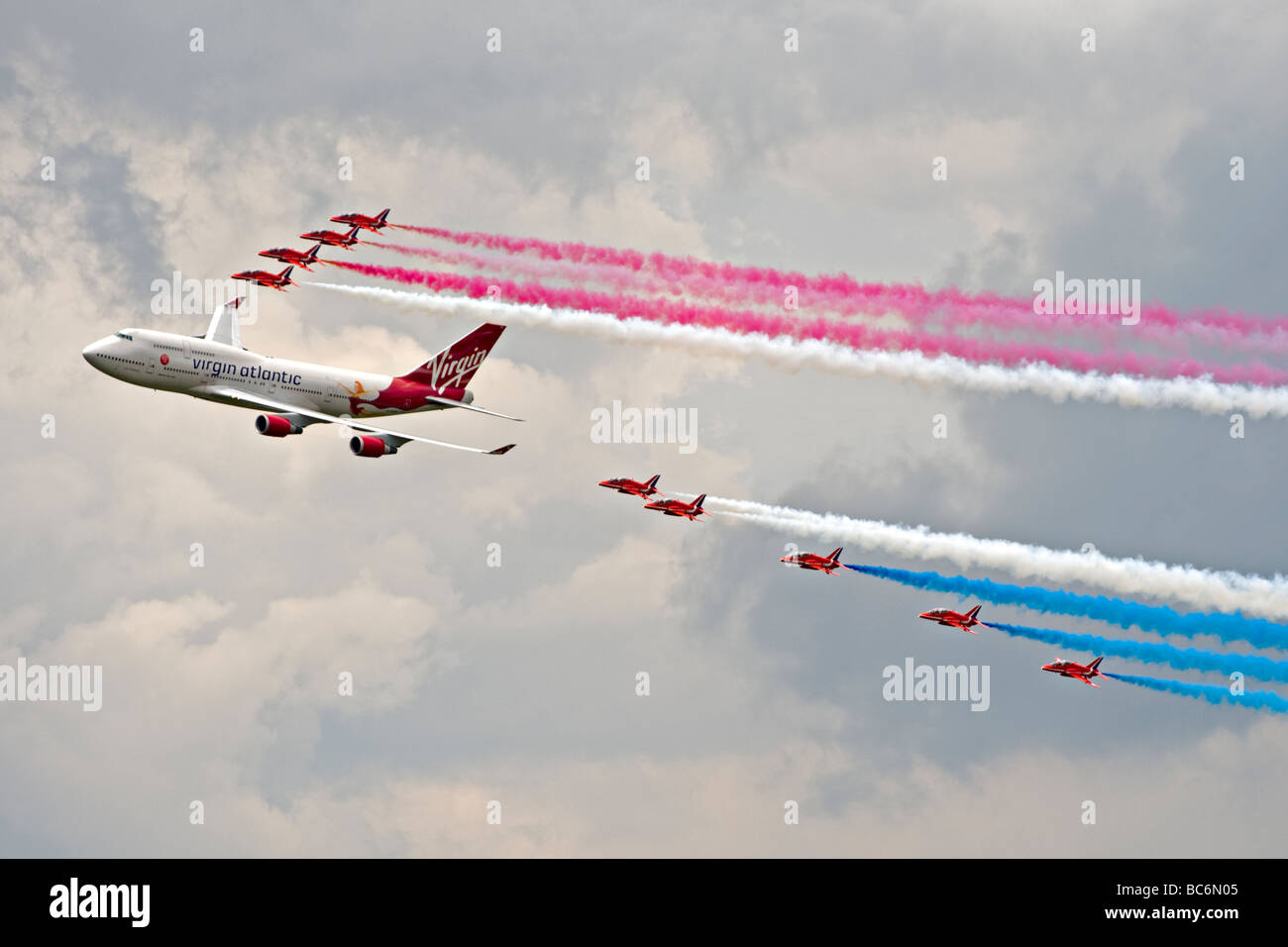 Virgin 747 Aircraft with The Red Arrows in formation during a flypast ...