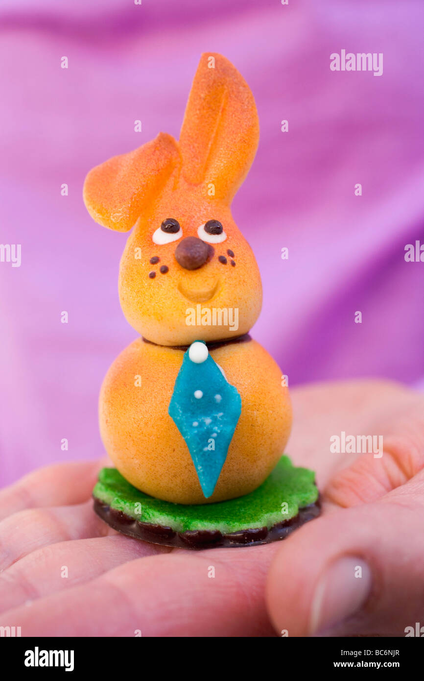 Hand holding marzipan Easter Bunny Stock Photo - Alamy