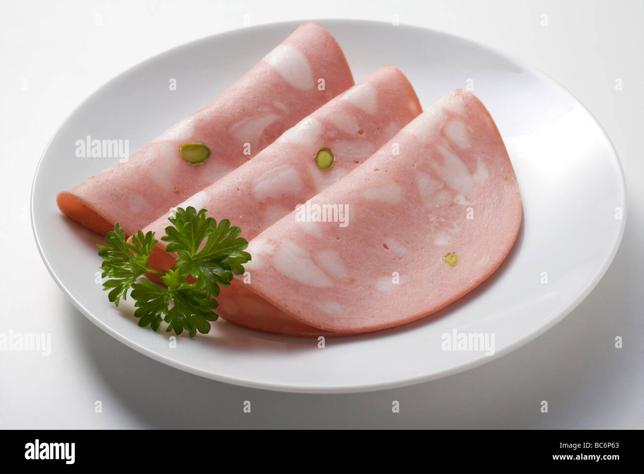 Mortadella with slices cut hi-res stock photography and images - Alamy