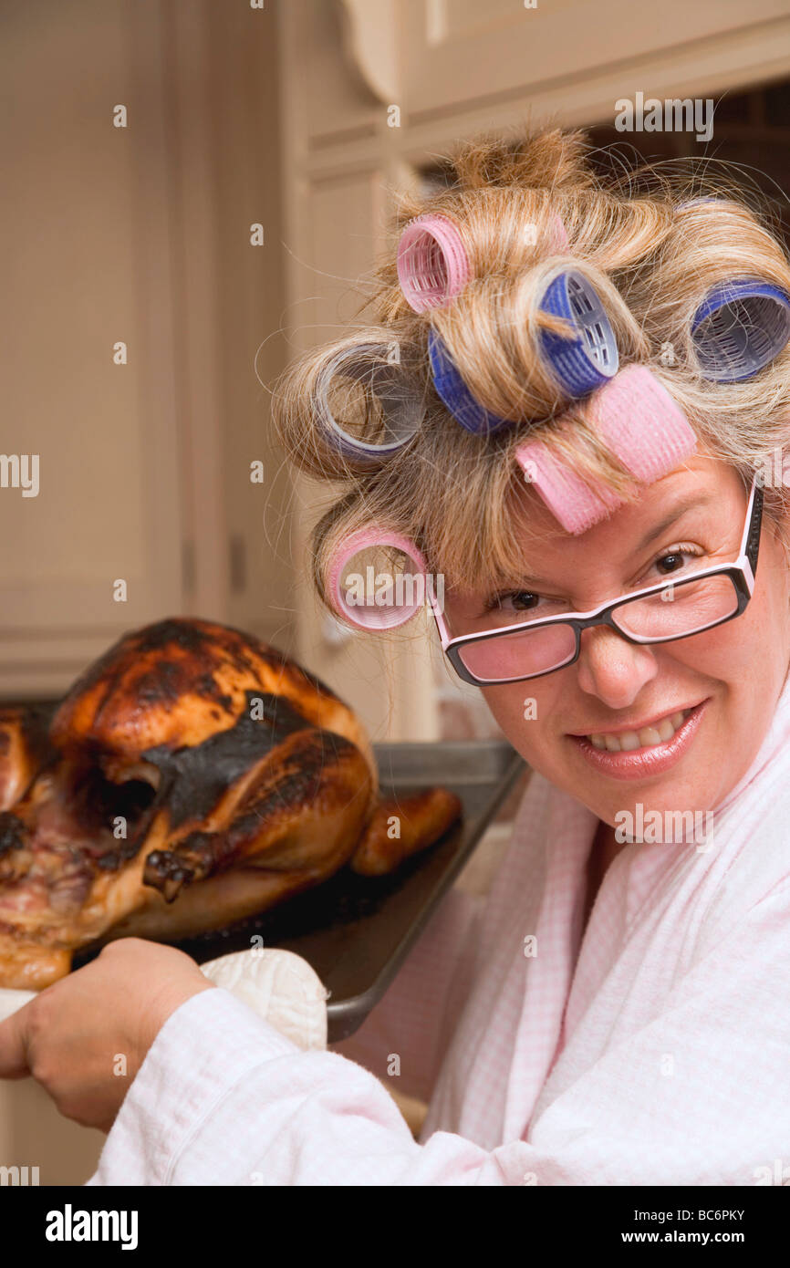 Housewife with burnt turkey in roasting tin Stock Photo - Alamy