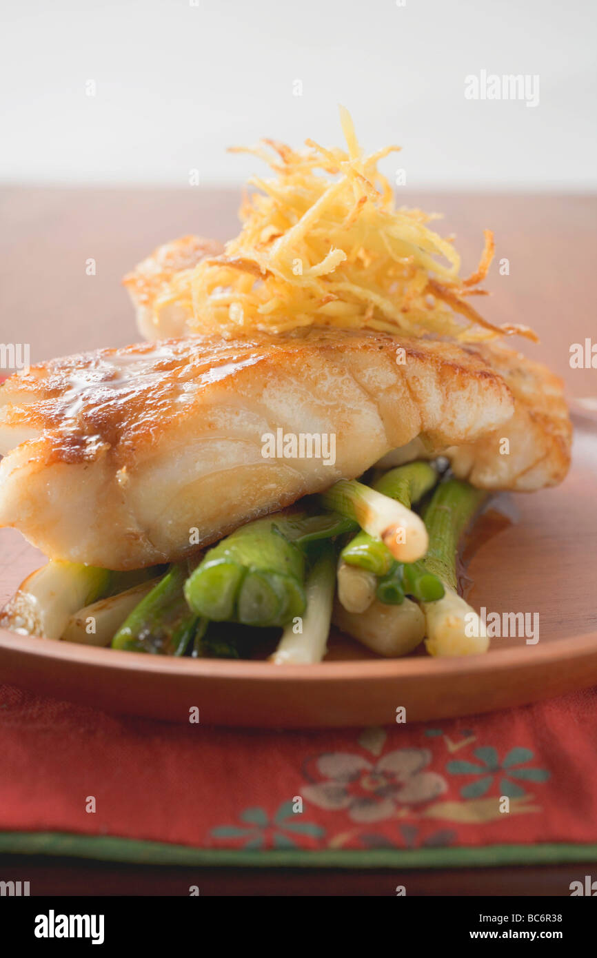 Fish fillet with spring onions Stock Photo - Alamy