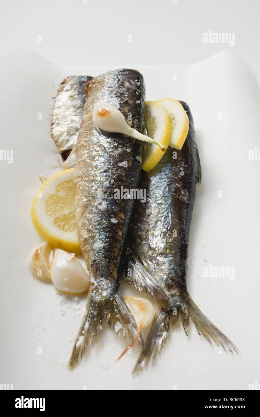 Marinated sardines with garlic and lemon Stock Photo - Alamy