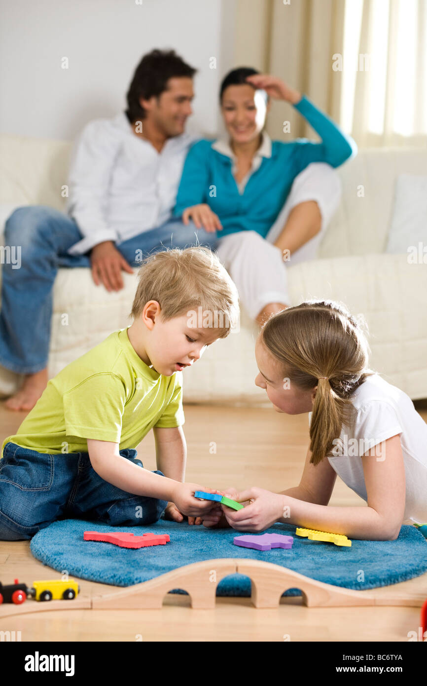 Family at home Stock Photo - Alamy