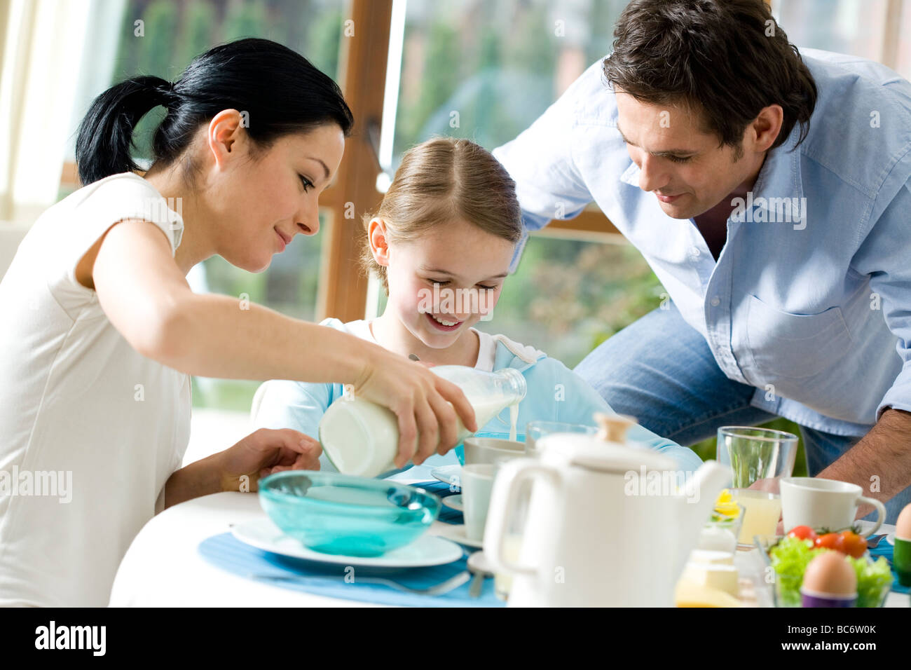 Family eating breakfast together Stock Photo - Alamy