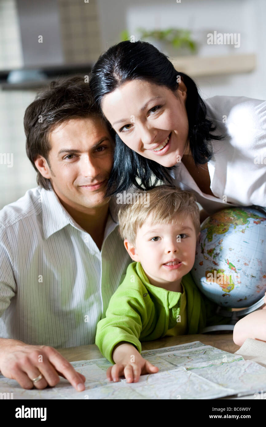 Family looking at map Stock Photo - Alamy