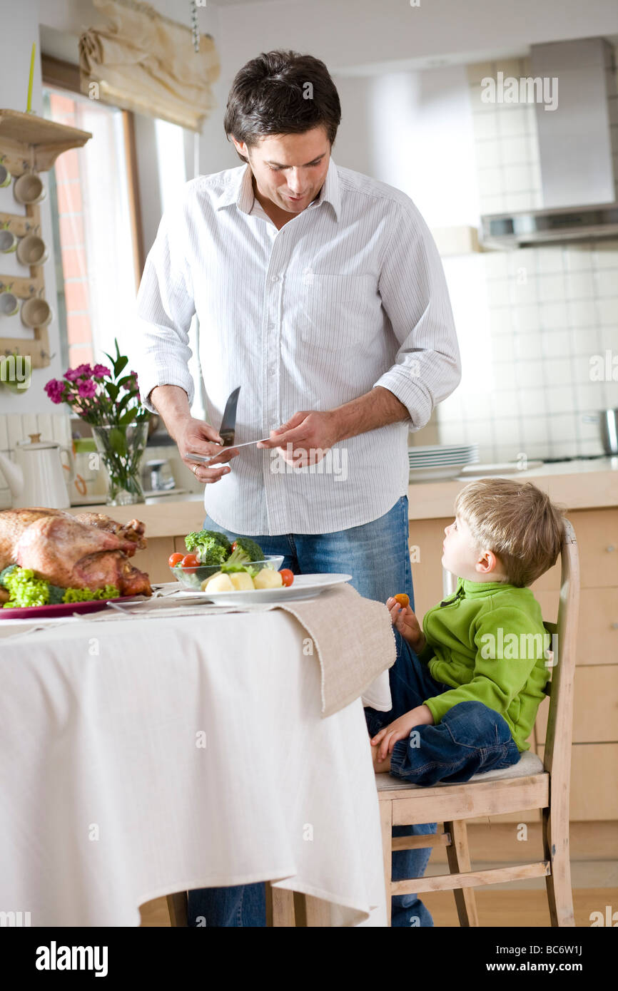 Father son sit dining hi-res stock photography and images - Alamy
