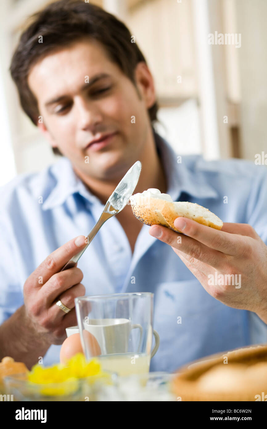 Man eating breakfast Stock Photo - Alamy
