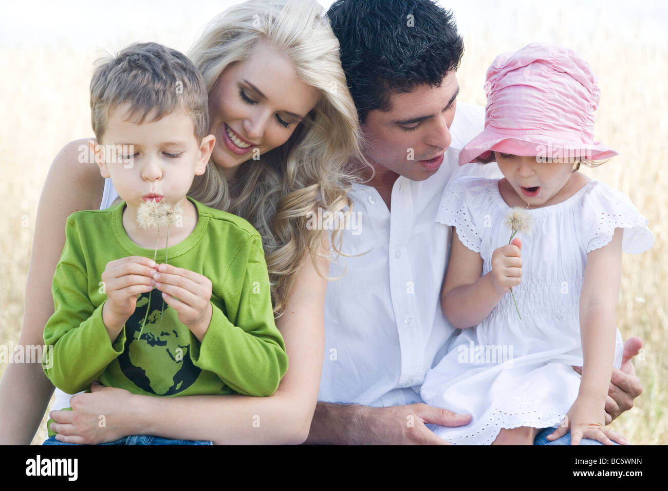 family walking on the field Stock Photo - Alamy