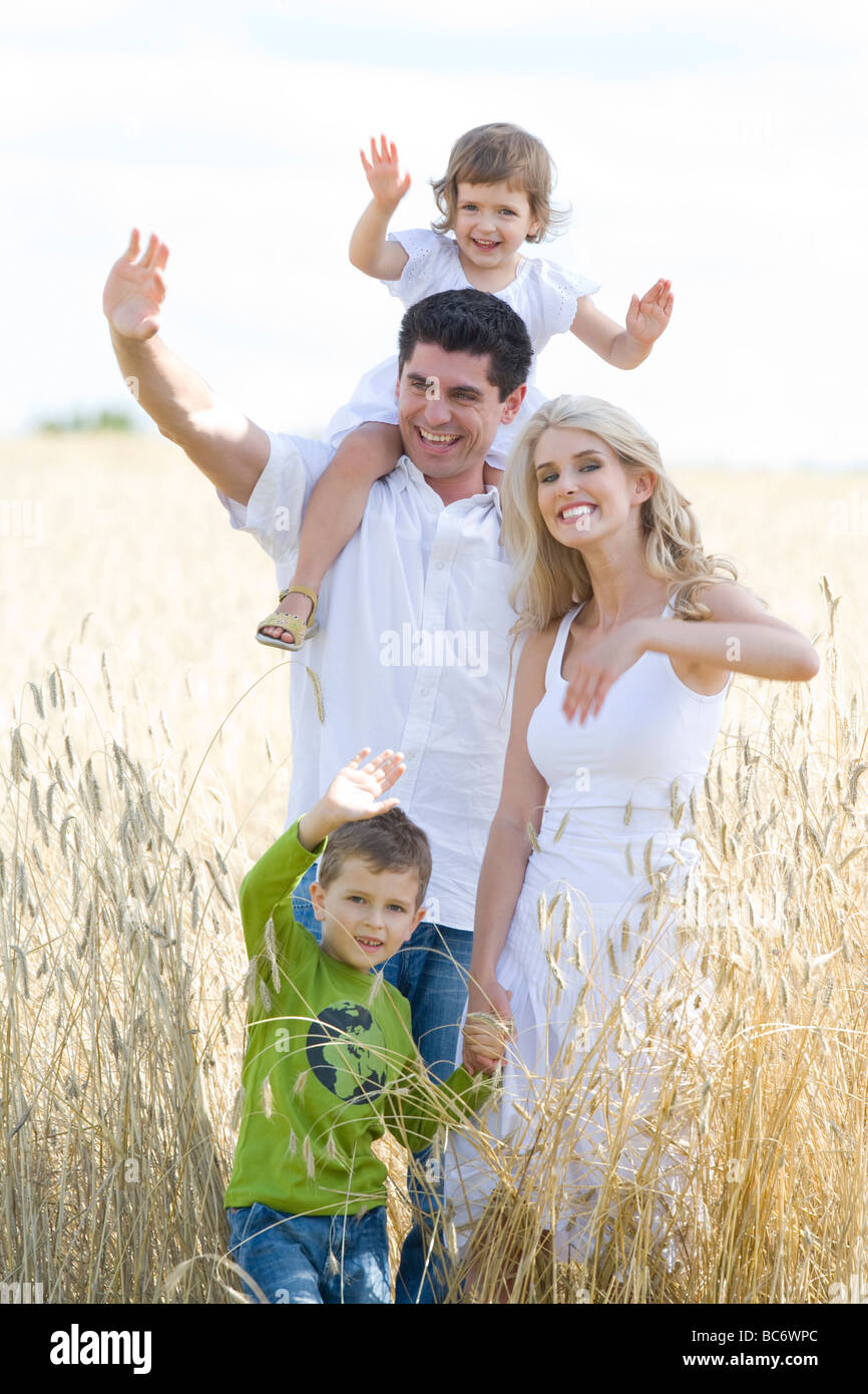 family walking on the field Stock Photo - Alamy