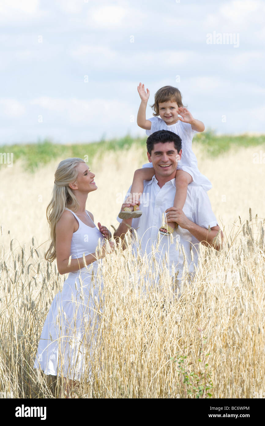 family walking on the field Stock Photo - Alamy