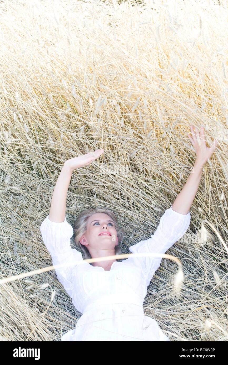 Woman lying in field wheat hi-res stock photography and images - Alamy