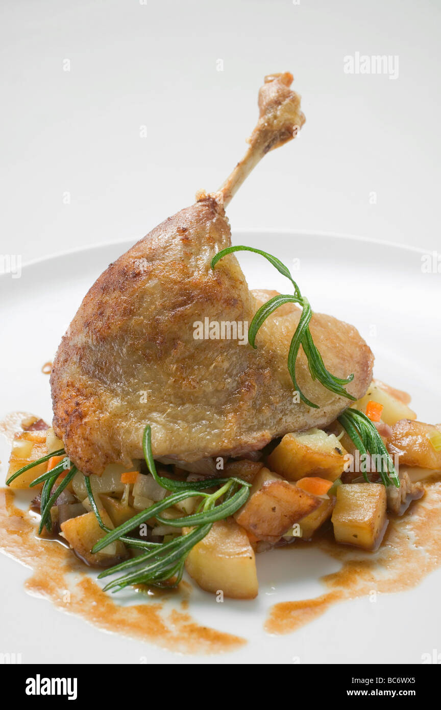 Fried goose leg on vegetables Stock Photo - Alamy