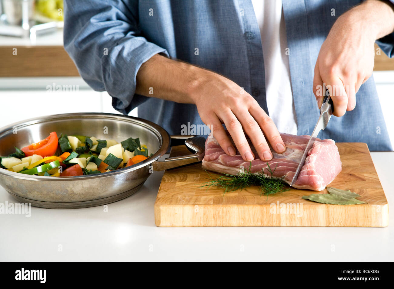 man cutting meat Stock Photo - Alamy