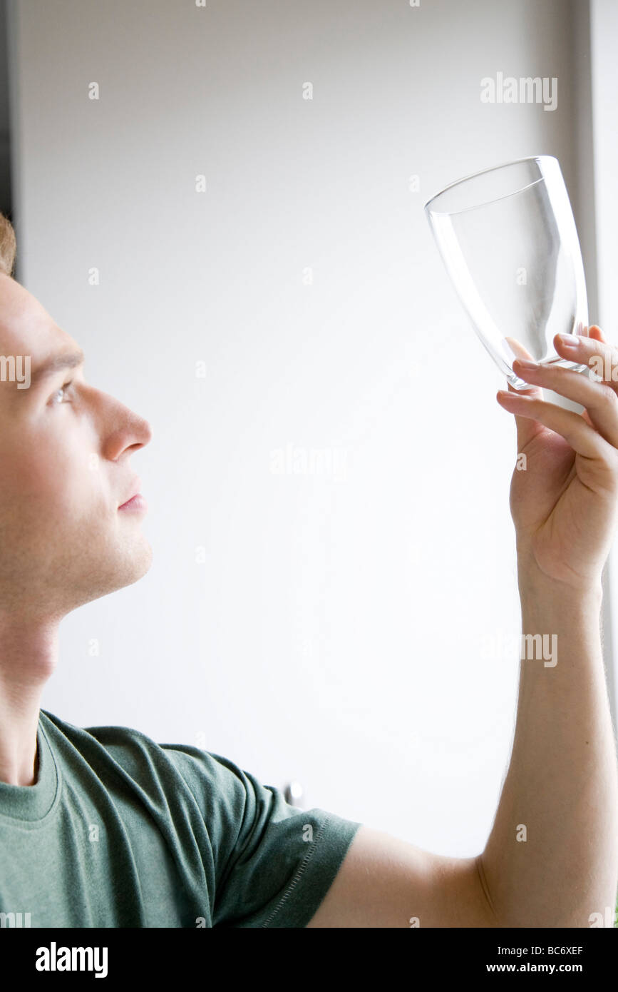 man checking glass Stock Photo - Alamy