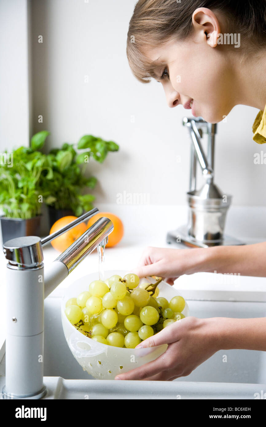 woman washing grapes Stock Photo - Alamy