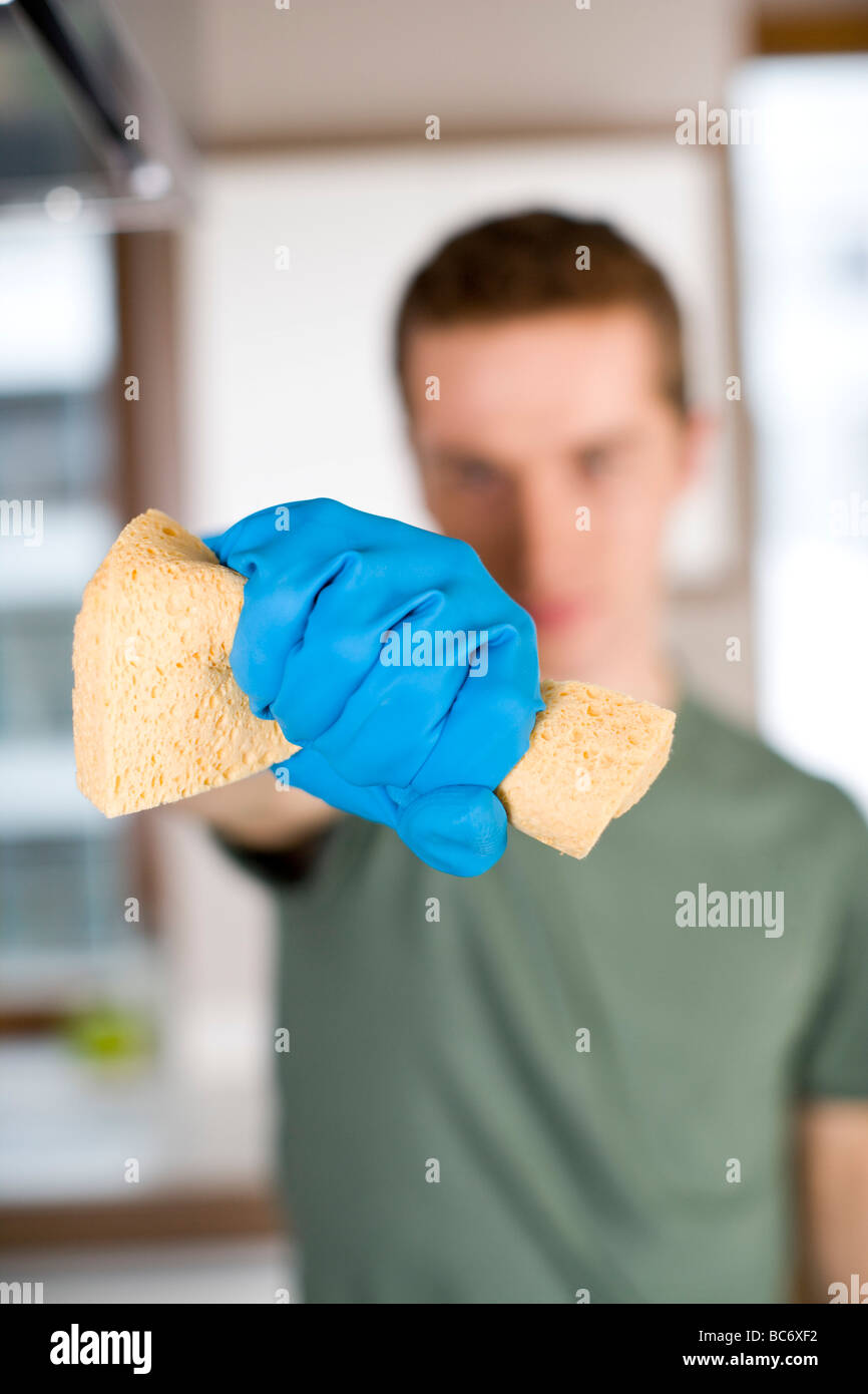 Squeezing sponge hi-res stock photography and images - Alamy