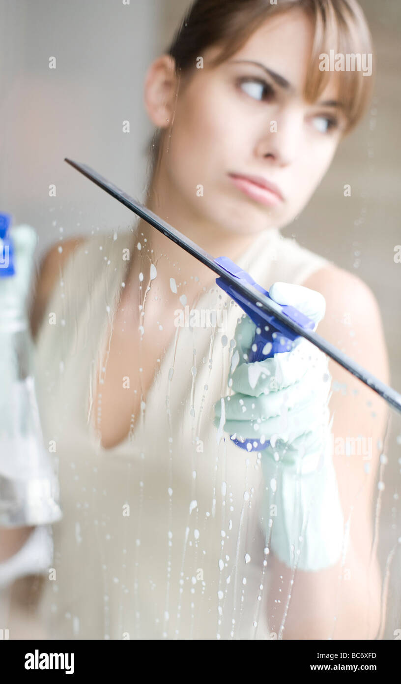 young woman washing windows Stock Photo - Alamy