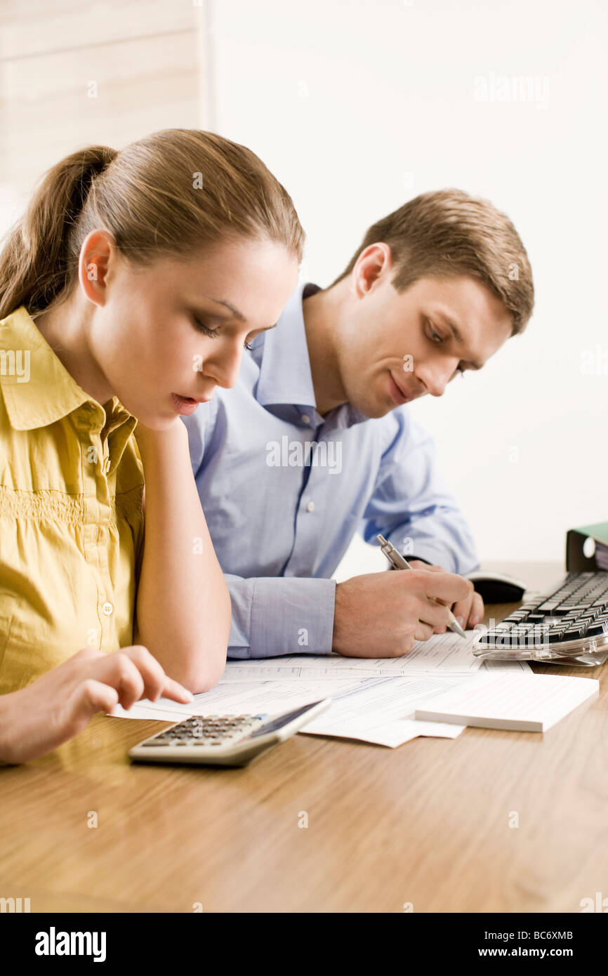 couple fill up tax return documents Stock Photo - Alamy