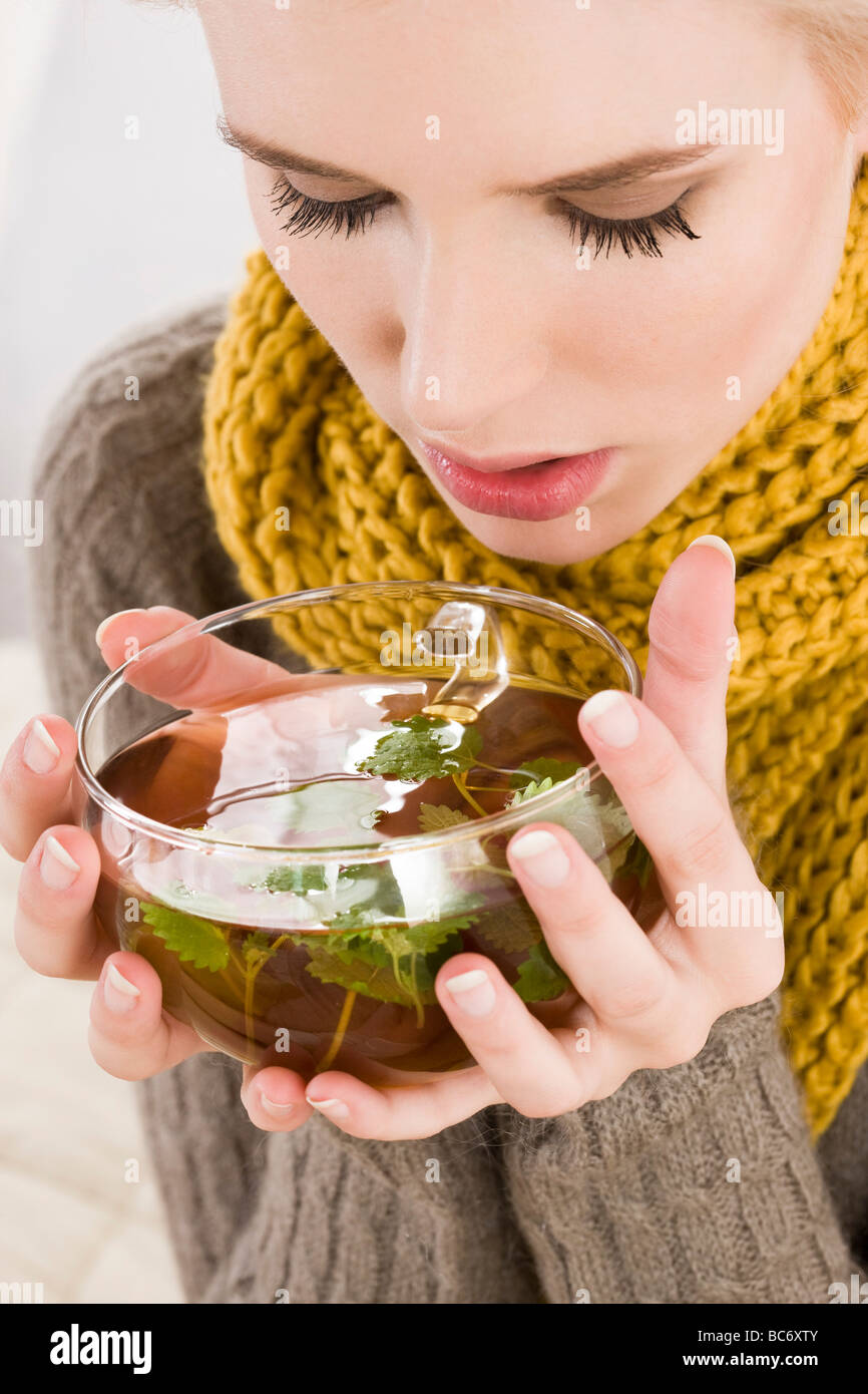 young woman drinking tea Stock Photo - Alamy