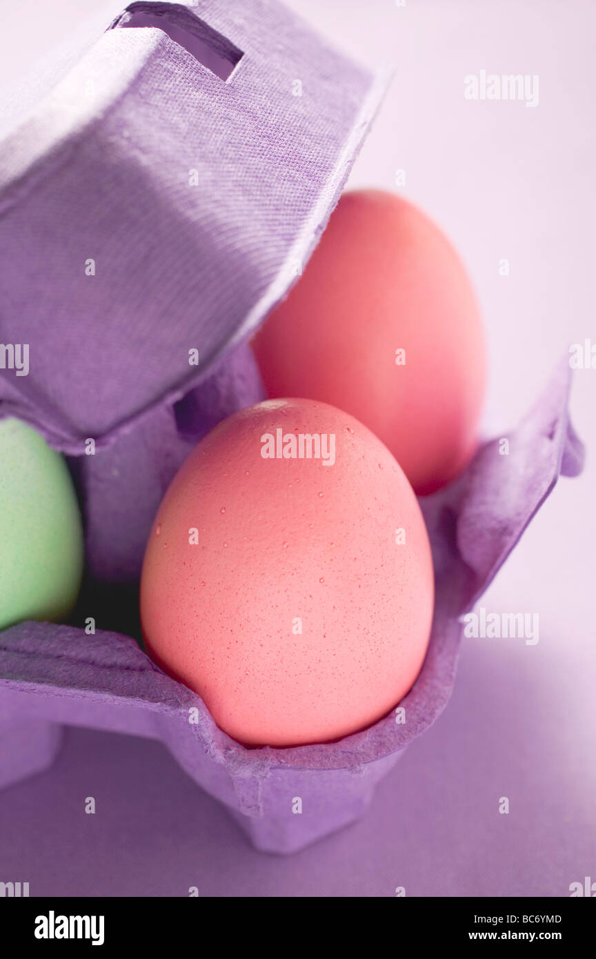 Coloured eggs in egg box Stock Photo - Alamy