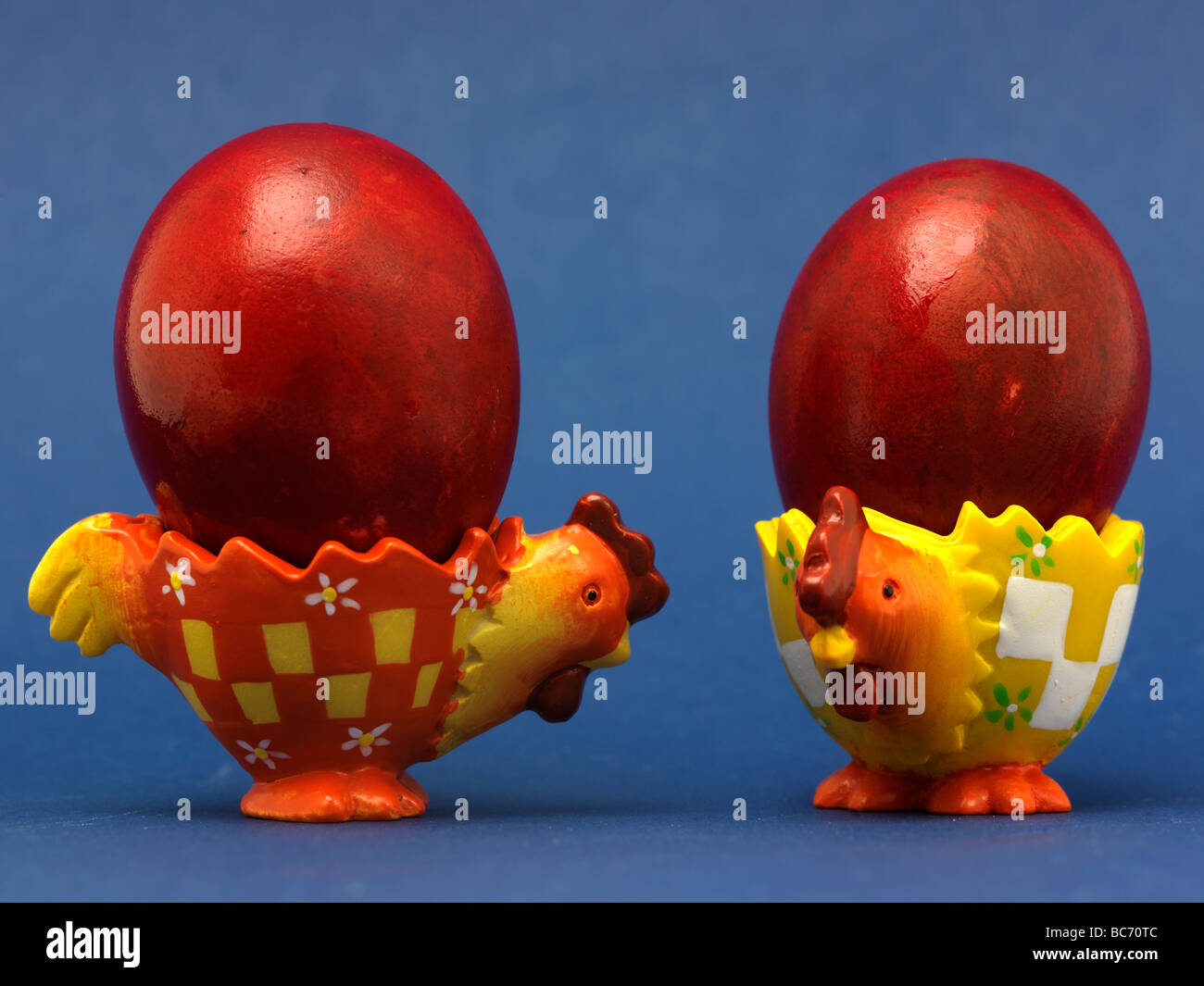 Two Red Eggs (Paschal Eggs) and Chicks Egg Cups at Easter Stock Photo ...