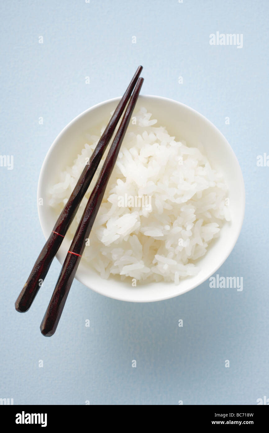 Bowl of rice with chopsticks Stock Photo - Alamy