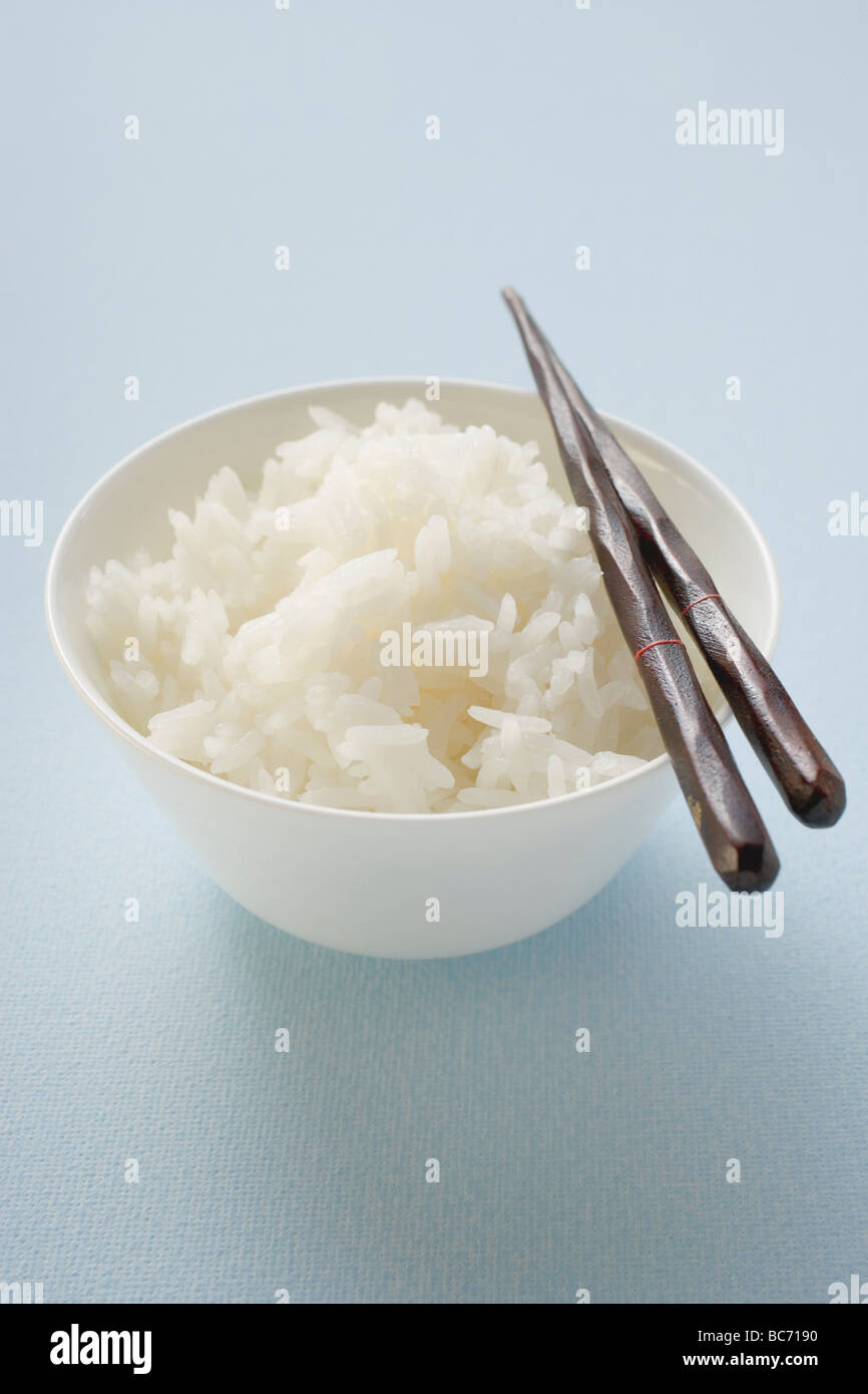 Bowl of rice with chopsticks Stock Photo - Alamy