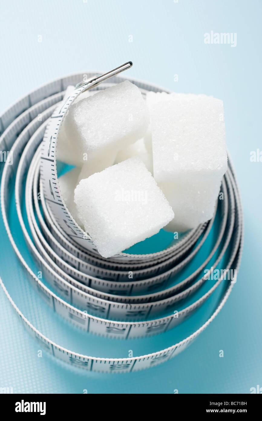 Tape measure and sugar cubes Stock Photo - Alamy
