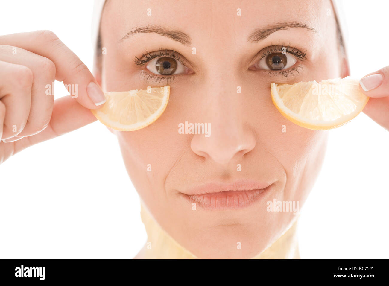 woman applying lemon facial mask Stock Photo - Alamy