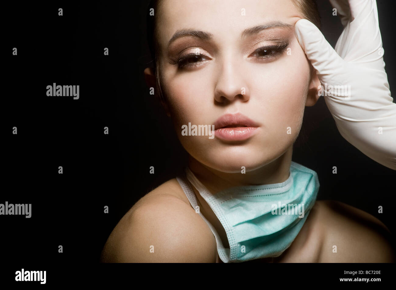Young woman examines face hi-res stock photography and images - Alamy