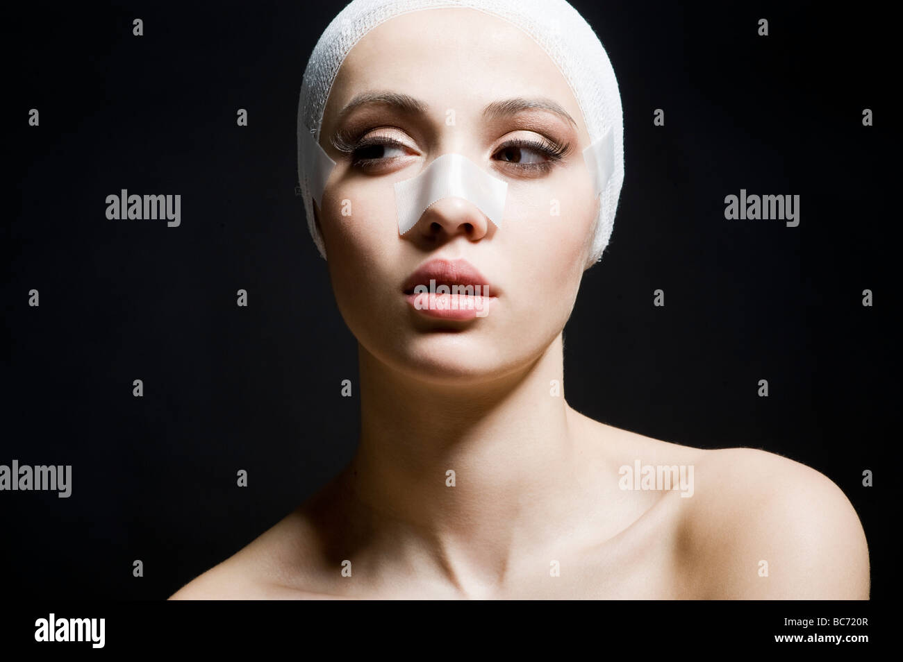 young woman with plaster on face Stock Photo - Alamy
