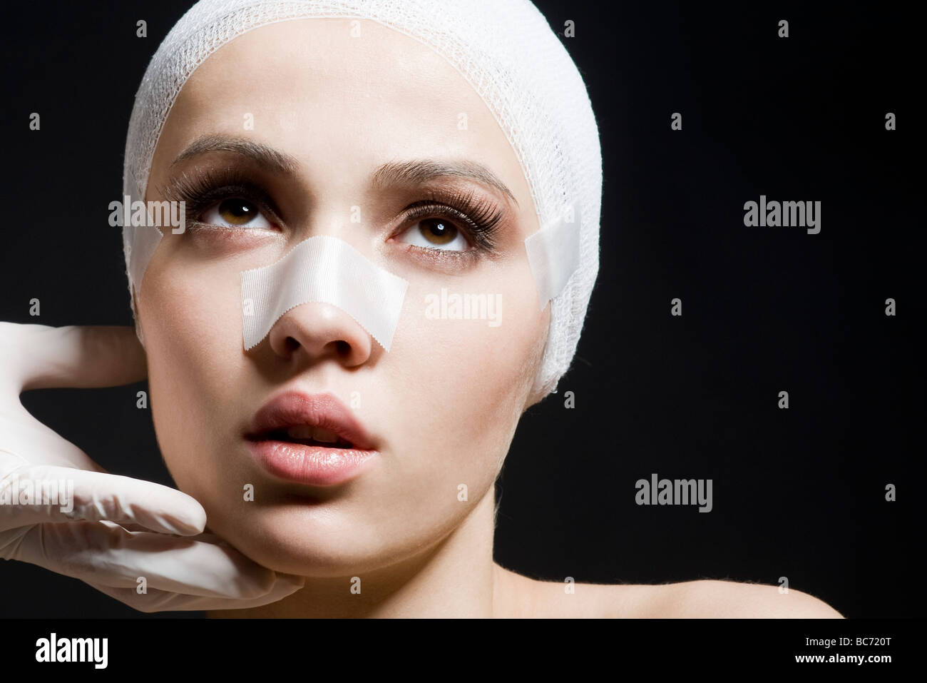 young woman with plaster on face Stock Photo - Alamy