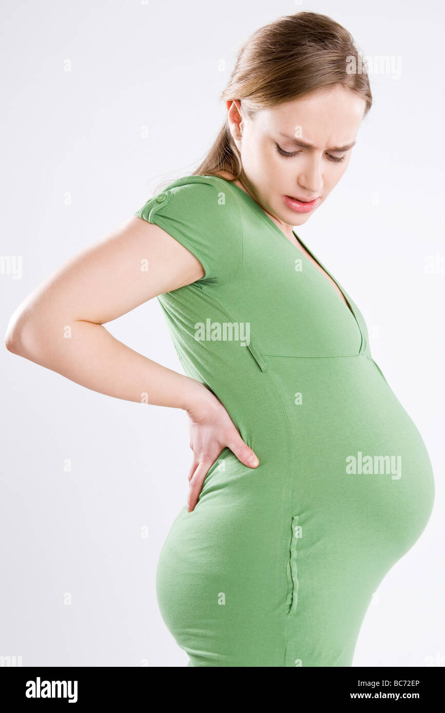 pregnant woman with back pain Stock Photo - Alamy