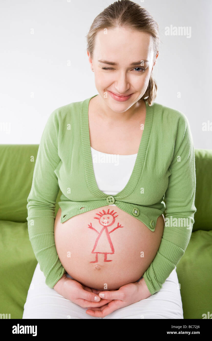 pregnant woman with doodle on belly Stock Photo - Alamy
