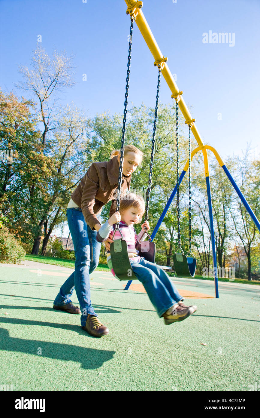 Child swing push hi-res stock photography and images - Alamy