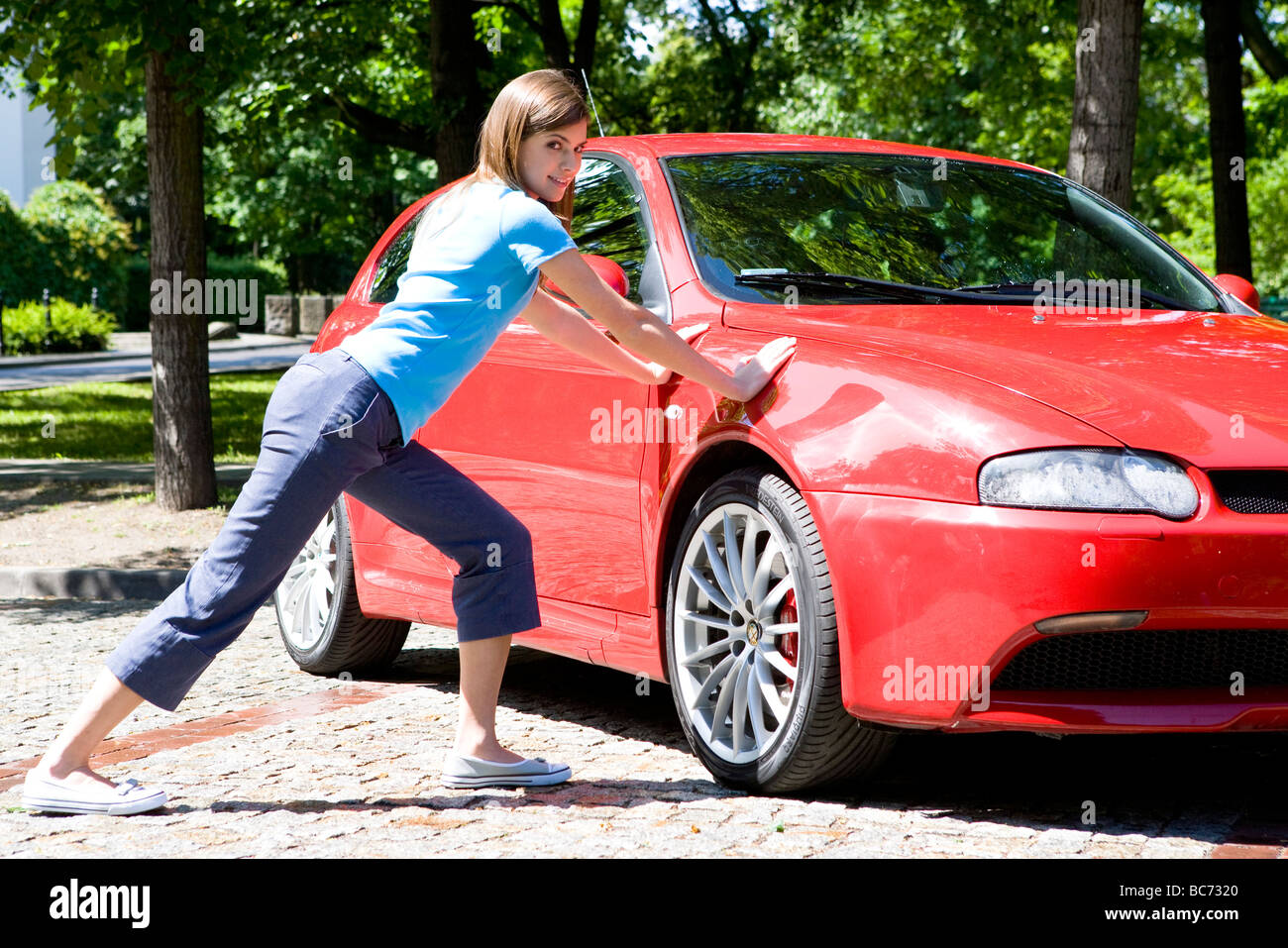 Stretching woman car hi-res stock photography and images - Alamy