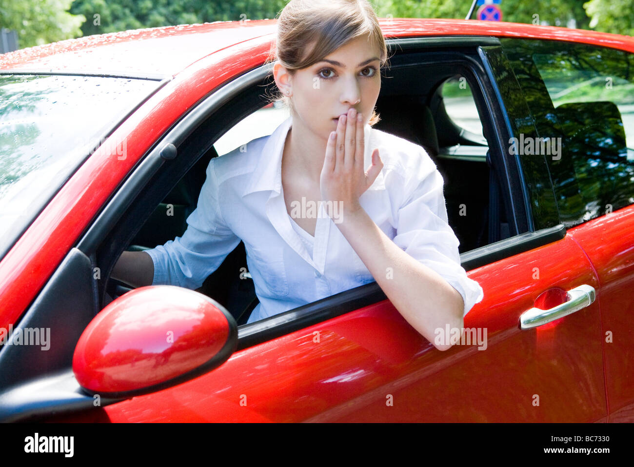 woman driving car caught by surprise Stock Photo - Alamy