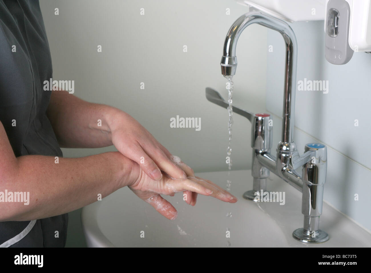 Nurse in NHS hospital washing hands. England, UK Stock Photo - Alamy