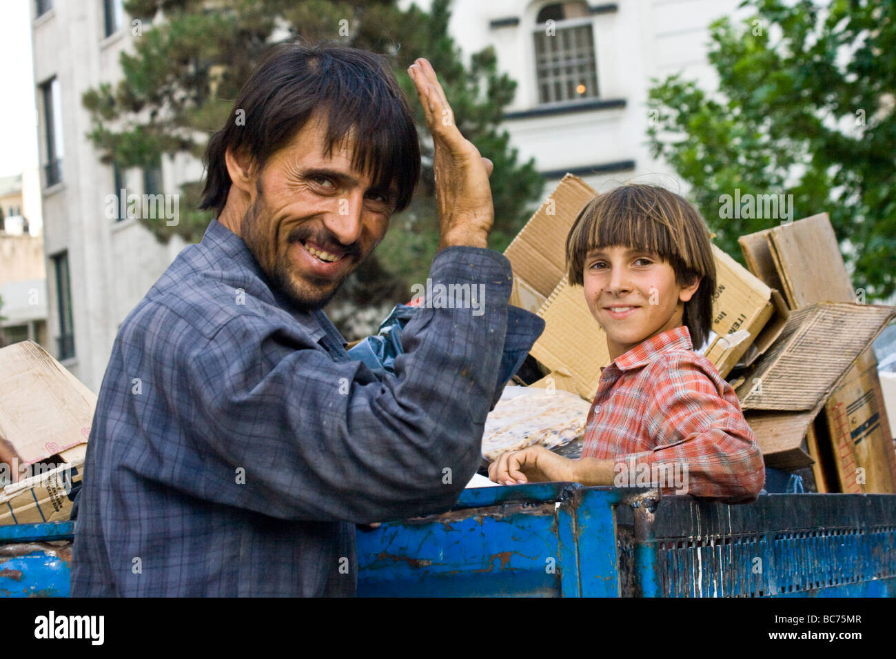 Poor Iranian Father and Son Picking through a Dumpster in Tehran Iran ...