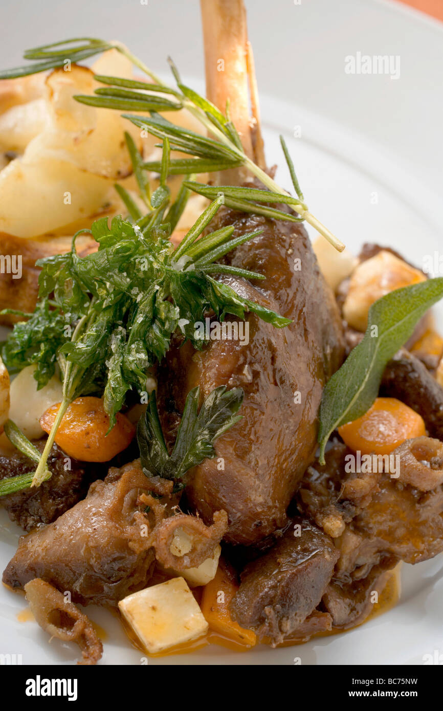 Braised goose leg with pear and onion tart Stock Photo - Alamy