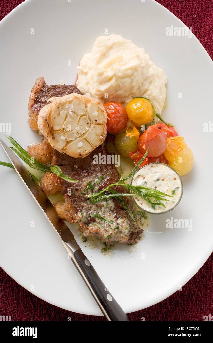 Steak With Tomatoes And Smashed Potatoes