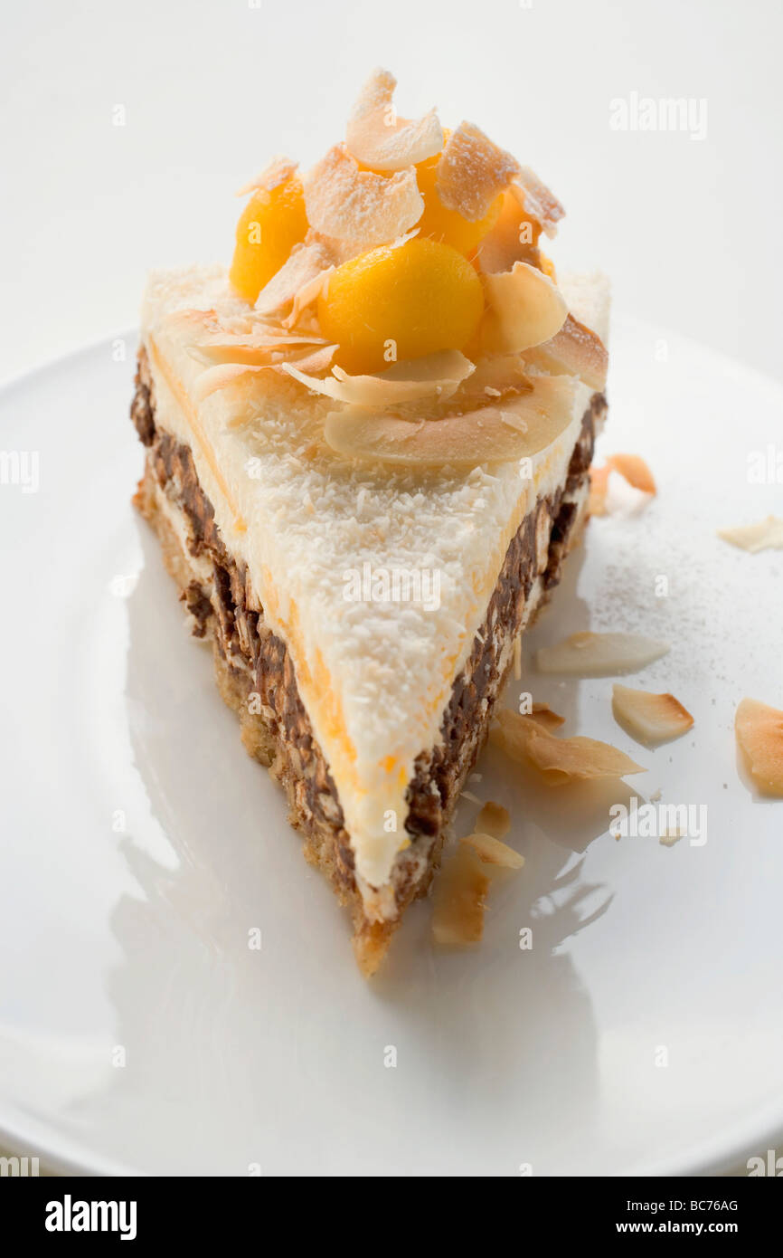 Piece of Creole cake with mango and pecans Stock Photo - Alamy